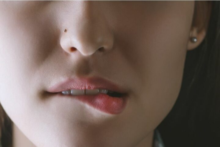 Girl Biting Lip: 10 Secret Meanings Behind This Playful Gesture