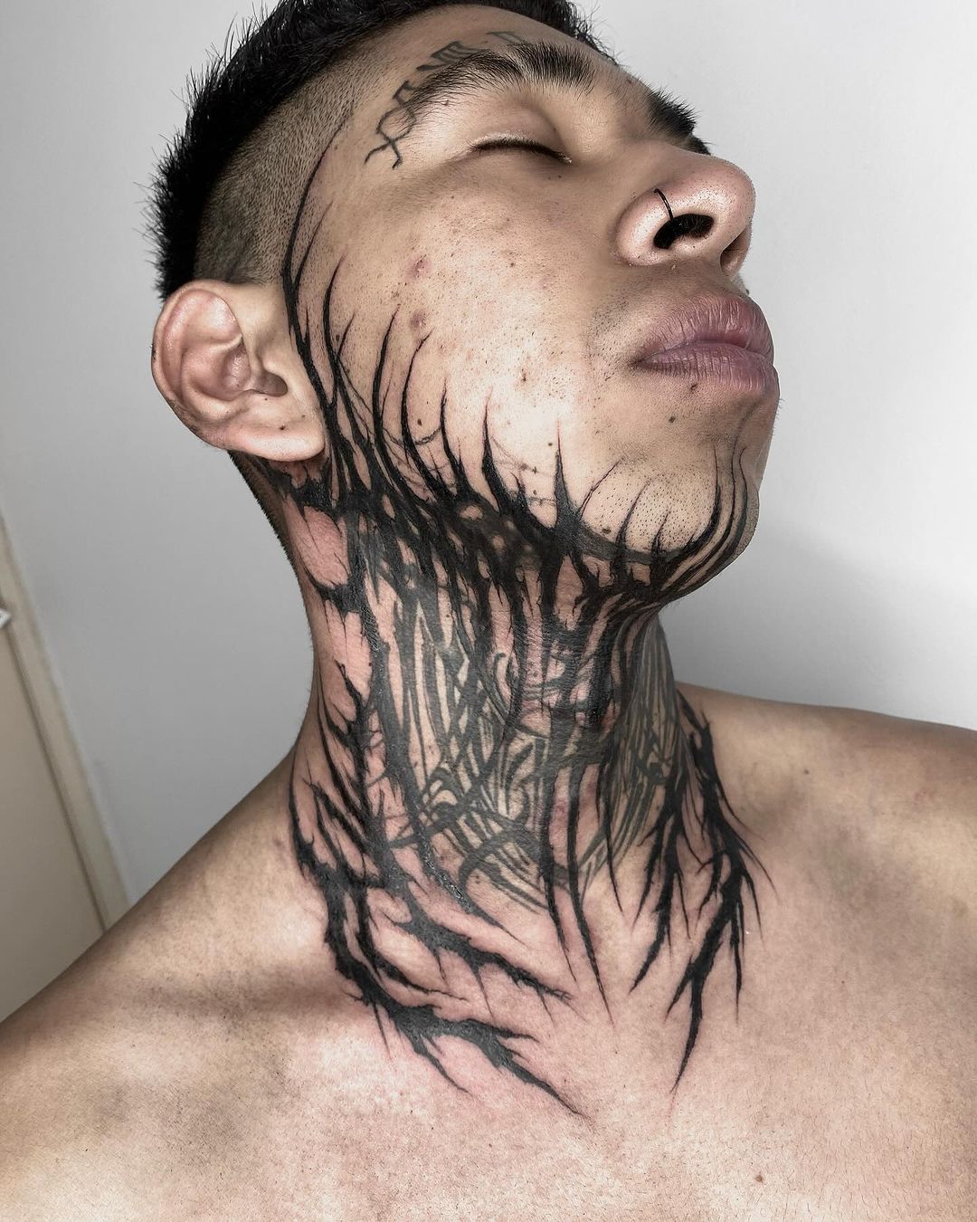 22 Incredibly Cool Neck And Throat Tattoos For Men