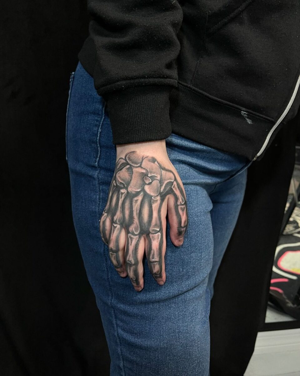 13 Eerie Bone Hand Tattoos That Will Give You Goosebumps