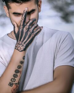 13 Eerie Bone Hand Tattoos That Will Give You Goosebumps