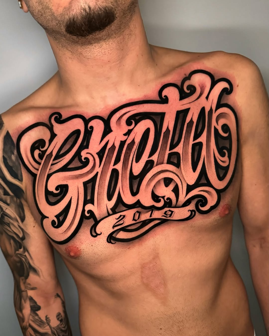 13 Bold And Cool Chest Tattoo Lettering Designs You'll Want To Get ...