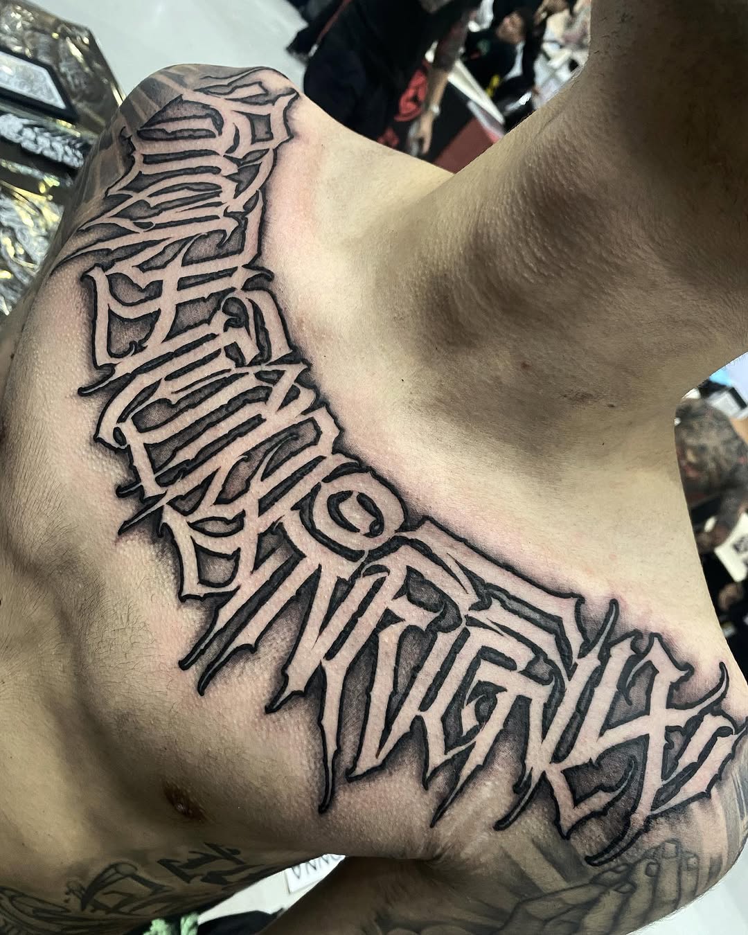 11 Expressive Chest Tattoo Lettering Ideas To Make A Powerful Statement